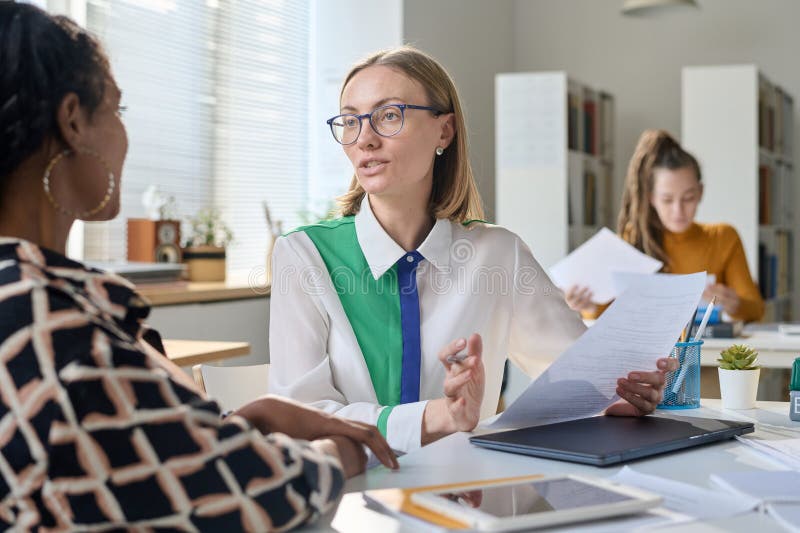 Female Teacher Discussing Topic with Student Stock Image - Image of ...