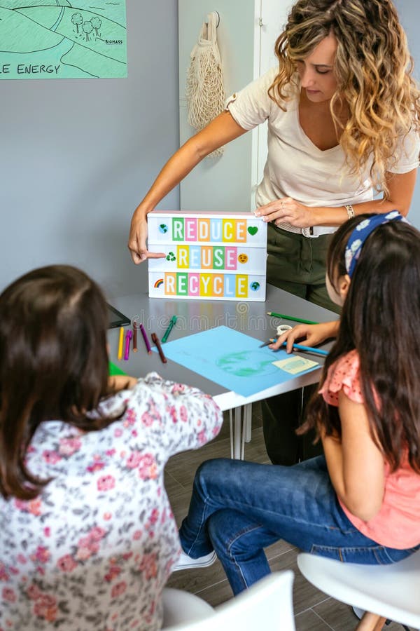 Teacher Explaining To Students a Ecologic Process Using Lightbox with ...