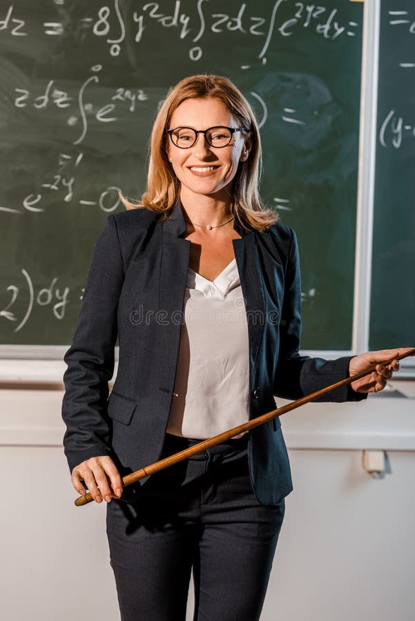 Female Teacher in Formal Wear with Wooden Pointer Explaining ...