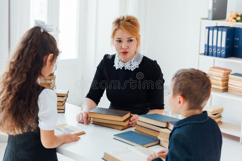 Female Teacher in a Lesson in a School Classroom with Children Stock ...