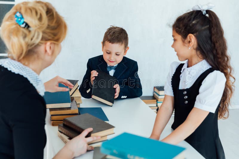 Female Teacher in a Lesson in a School Classroom with Children Stock ...
