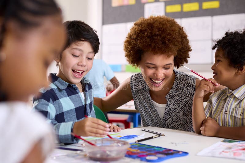 Female Teacher with Multi-Cultural Elementary School Pupils in Art ...