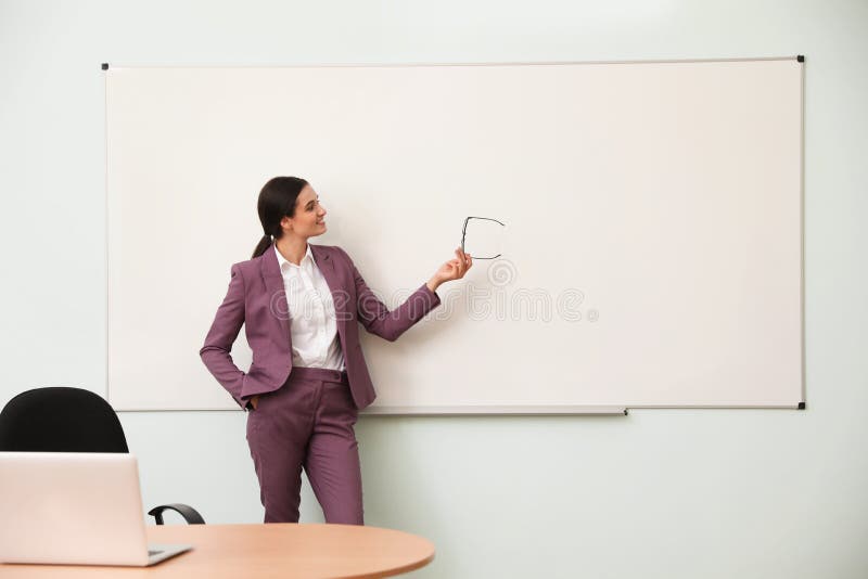 Female Teacher Near Whiteboard in Modern Classroom Stock Photo - Image ...