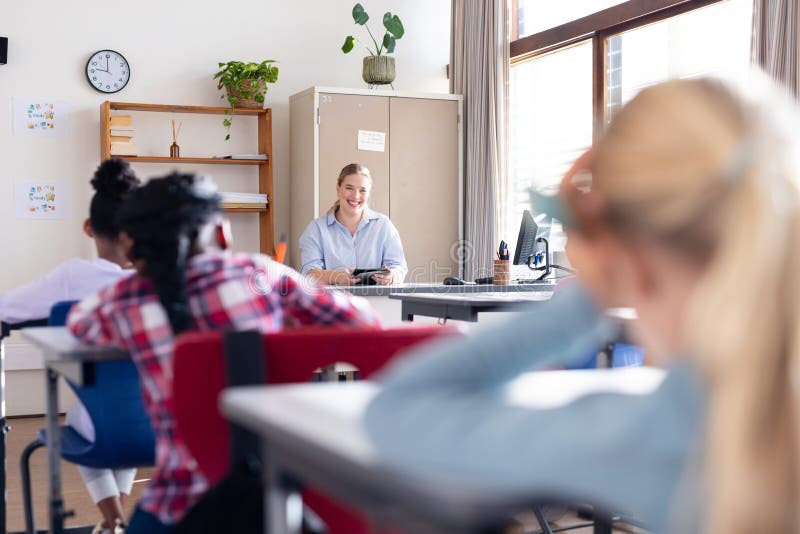 Female Teacher Smiling Engaging Diverse Students Classroom School Lesson Stock Photos - Free ...