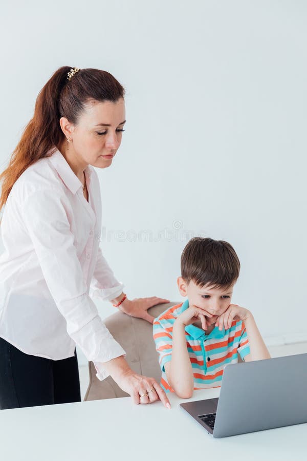 Female Teacher Teaches Boy To Work on Computer Online Stock Image ...