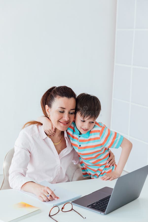 Female Teacher Teaching Boy at Desk with Laptop Online Stock Photo ...