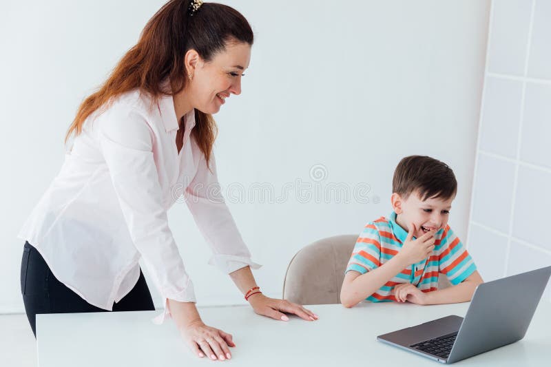 Female Teaching Kids To Work on Computer Stock Photo - Image of young ...