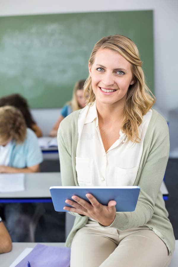 Female Teacher Using Digital Tablet in Class Stock Image - Image of ... Female Teacher Using Digital Tablet in Class Stock Image - Image of ...