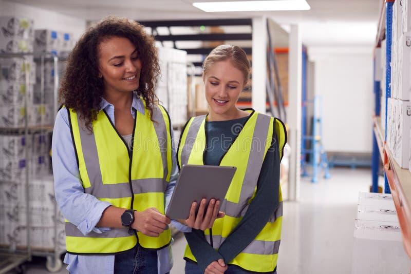 Female Team Leader with Digital Tablet in Warehouse Training Intern ...