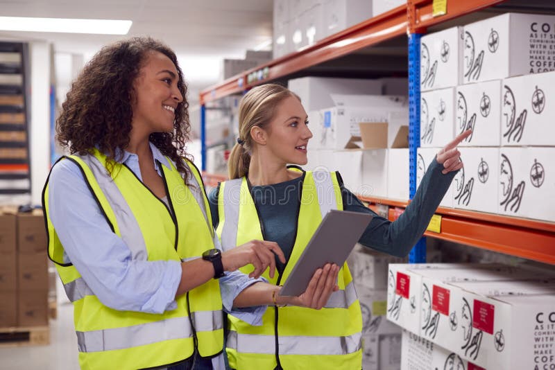 Female Team Leader with Digital Tablet in Warehouse Training Intern ...