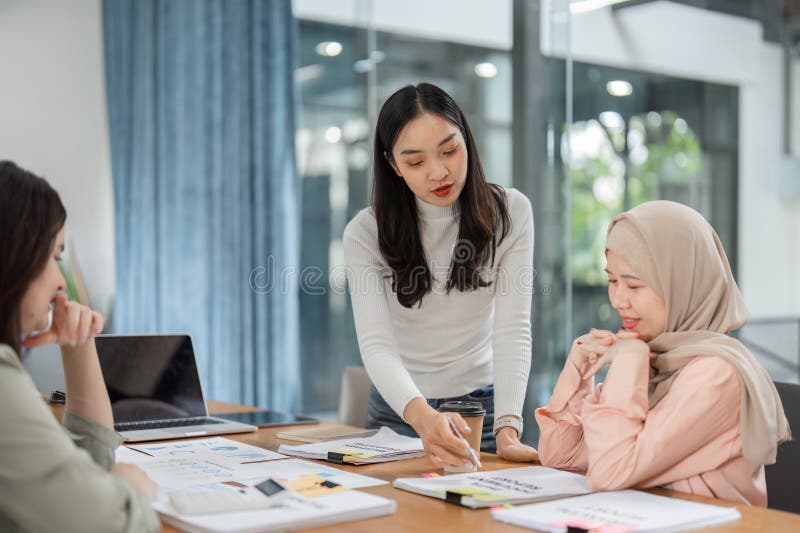 Female Team Members Brainstorming Ideas in a Collaborative Office ...