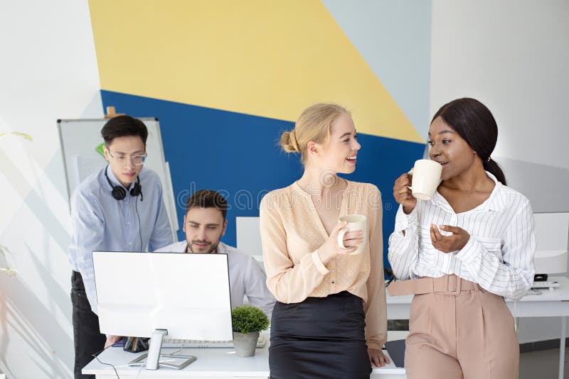 Female Tech Support Operators Having Coffee and Friendly Chat during ...