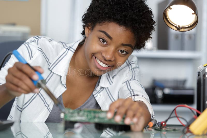 Female Technician Fixing Computer Hardware Stock Photo - Image of ...