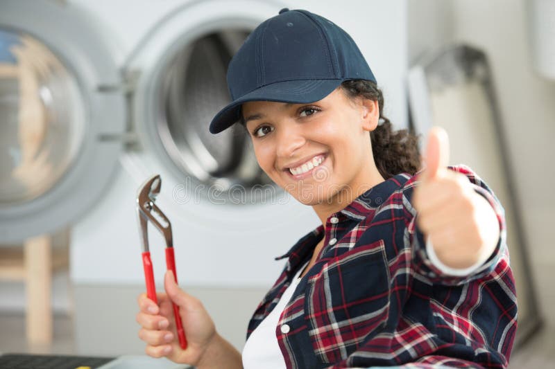 Female Technician Fixing Washing Machine Stock Image - Image of washing ...