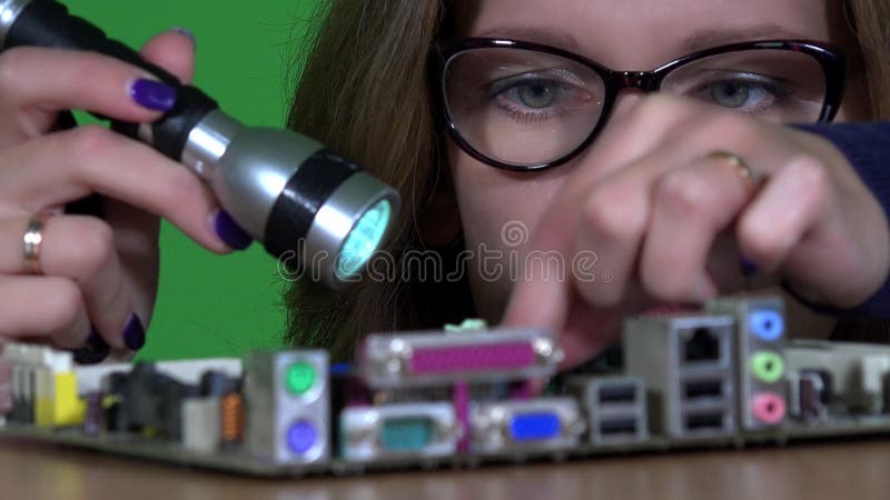 Female Technician Girl with Glasses Inspect Computer Components with ...