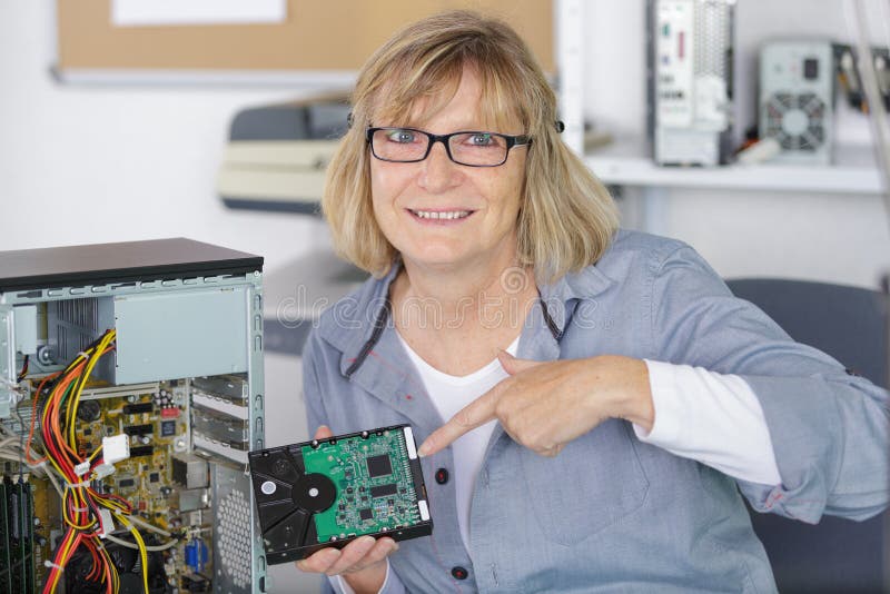 Female Technician Pointing at Repaired Computer Stock Image - Image of ...