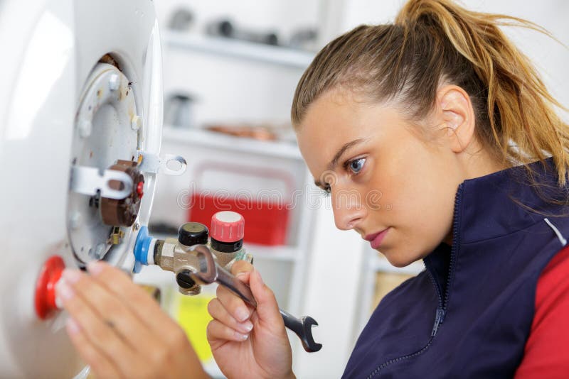 Female Technician Servicing Boiler Stock Photo - Image of head ...