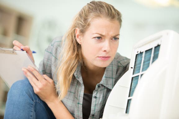 Female Technician Taking Notes Stock Photo - Image of machine ...