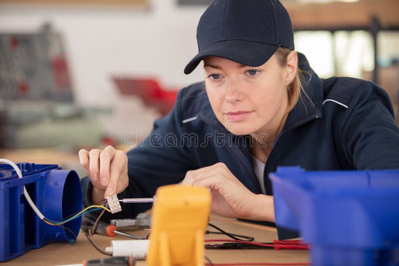 Female Technician Wiring Cables into Chocolate Box Stock Photo - Image ...