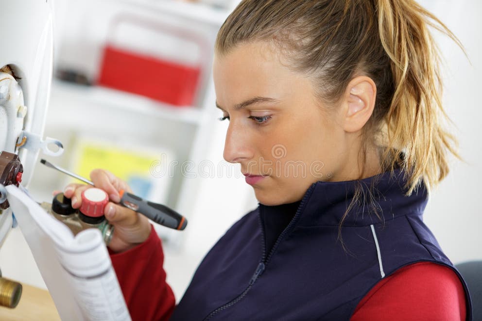 Female Trainee Plumber Working on Central Heating Boiler Stock Image ...