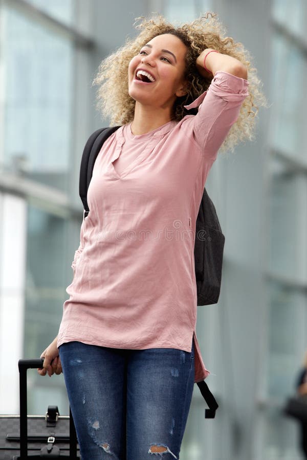 Female Traveler Smiling with Suitcase and Backpack Stock Photo - Image ...