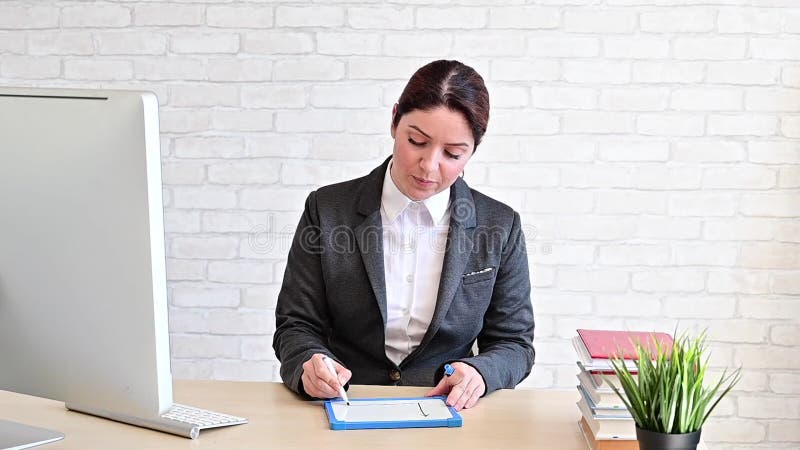 A Female Tutor Explains the Rules for Building a Schedule. Stock ...