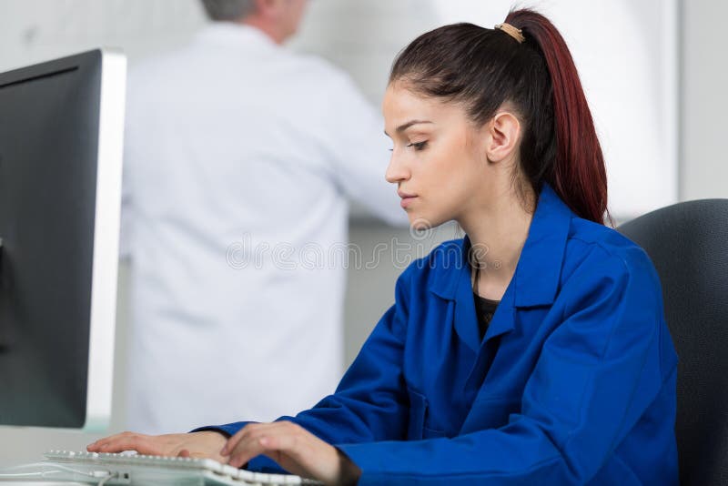 Female Tutor Using Computer in it Class Stock Image - Image of desk ...