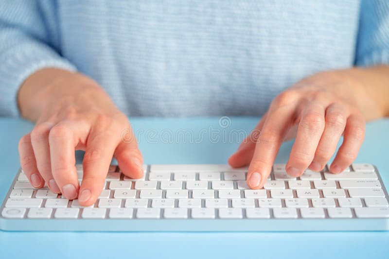 Female Typing Text on White Keyboard on Blue Background. Copy Space ...