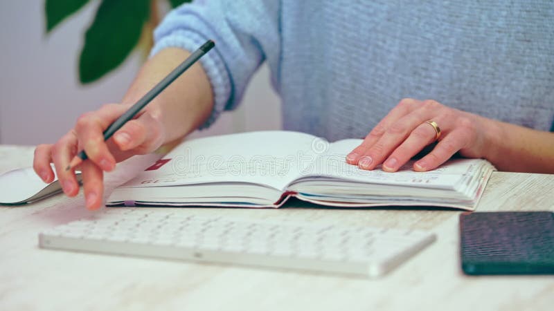 Female Typing Text on White Keyboard and Wring Down Some Data. Slow ...