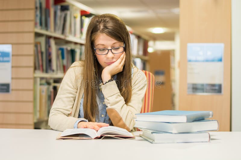 Female University Student Reading in the Library Stock Image - Image of ...