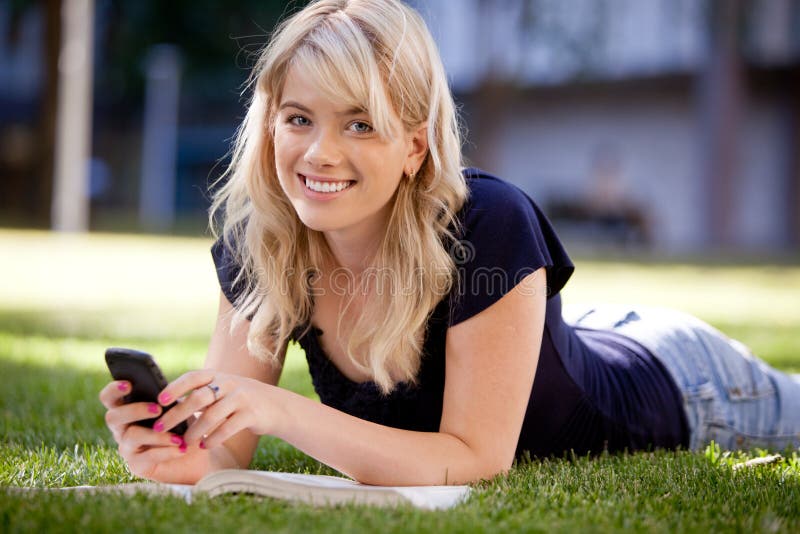 Female University Student Sending Text Stock Photo - Image of american ...