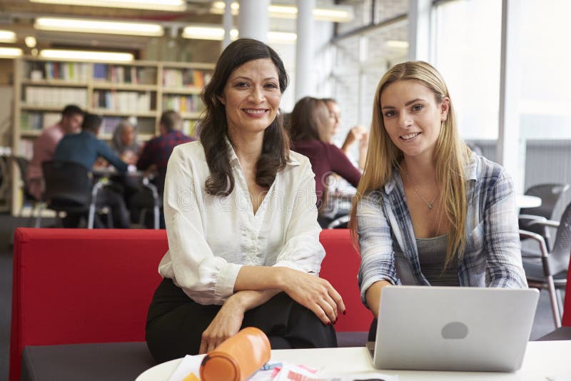 Group Of Students Meeting For Tutorial With Teacher Stock Photo - Image ...
