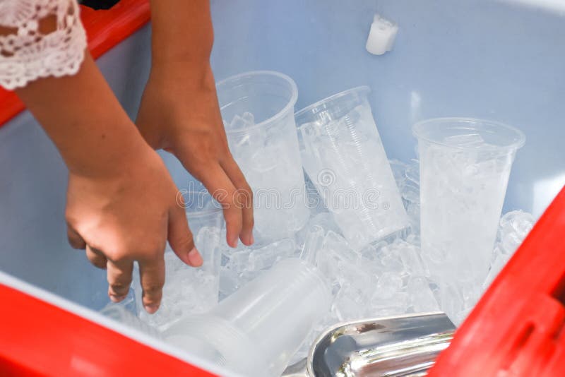 Metal Ice Scoop and Plastic Cup on the Ice in Bucket Stock Photo ...