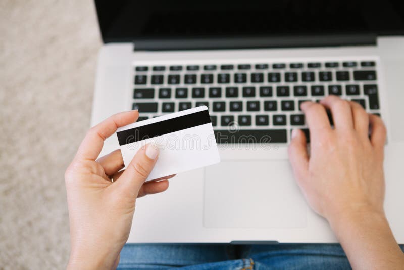 Female Using Computer for Online Shopping Holding Credit Card Stock ...