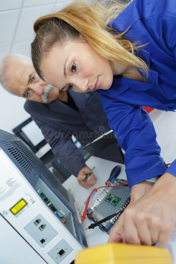 Female Using Digital Multimeter on Motherboard Stock Image - Image of ...