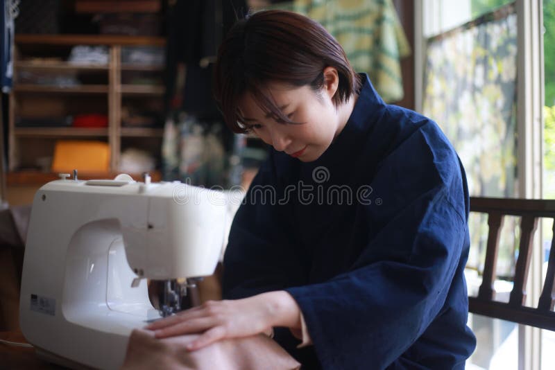 Female Using a Sewing Machine Stock Photo - Image of model, fabric ...