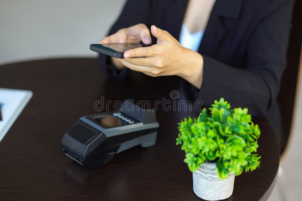 A Female Using Smartphone To Scan QR Code on Terminal Machine Stock ...