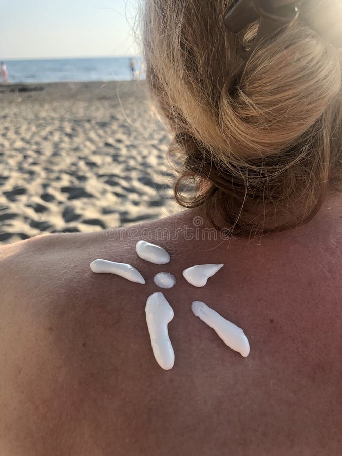 Female Using Sun Cream on the Beach. Stock Photo - Image of lotion ...