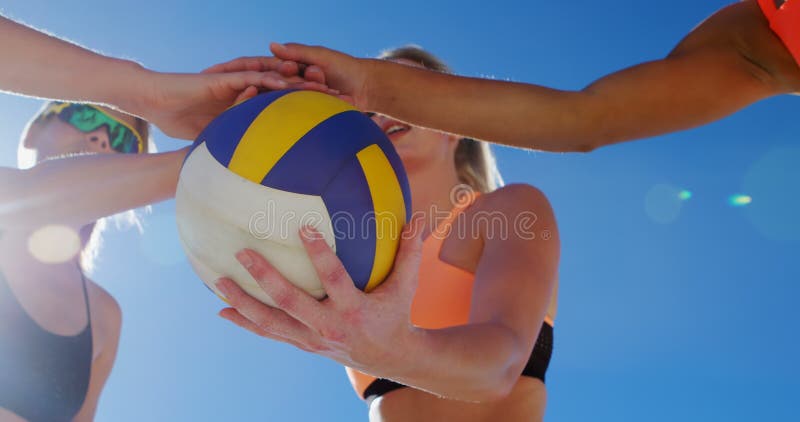 A Female Volleyball Player in a Red Black Sports Uniform Bouncing and ...