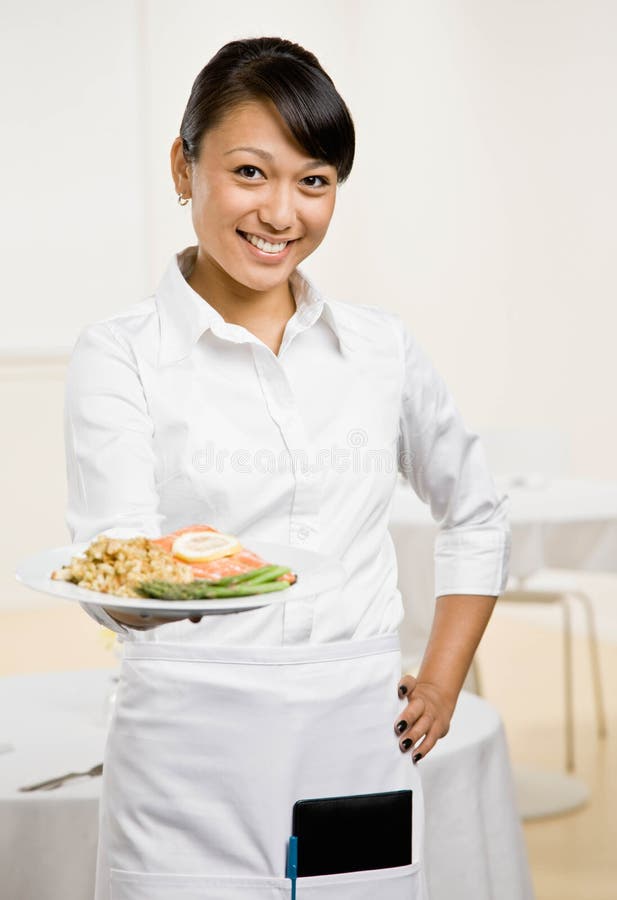 Female Waiterss Offers Plate of Food Stock Photo - Image of young ...