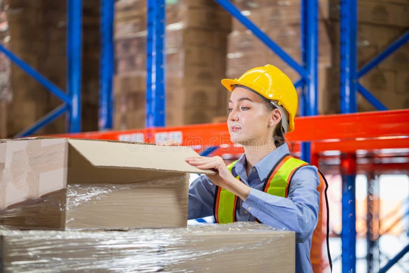 Female Warehouse Worker Working in Distribution Warehouse, Distillery ...