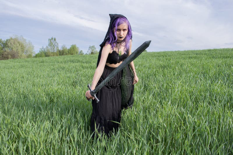 Female Warrior with Big Sword in the Green Field Stock Image - Image of ...