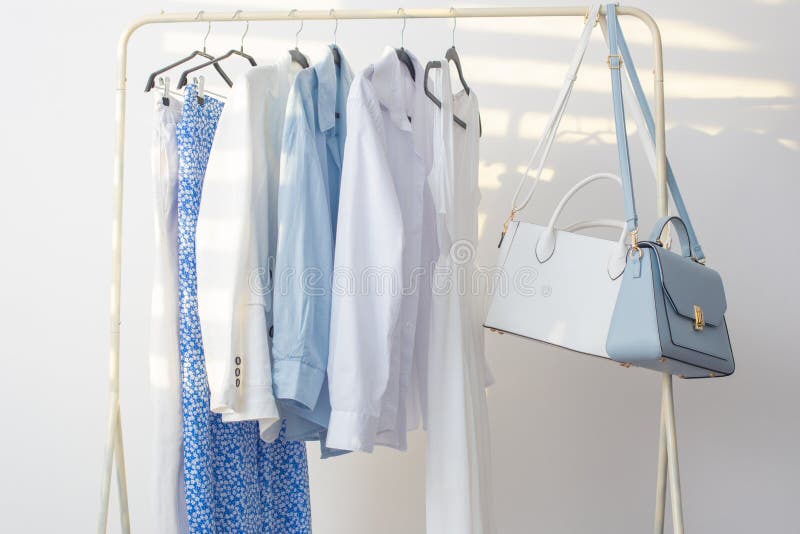 Female White and Blue Summer Wardrobe in White Room Stock Photo - Image ...