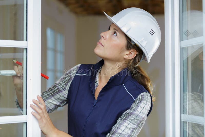 Female Window Fitter at Work Stock Image - Image of lookingup, inspect ...