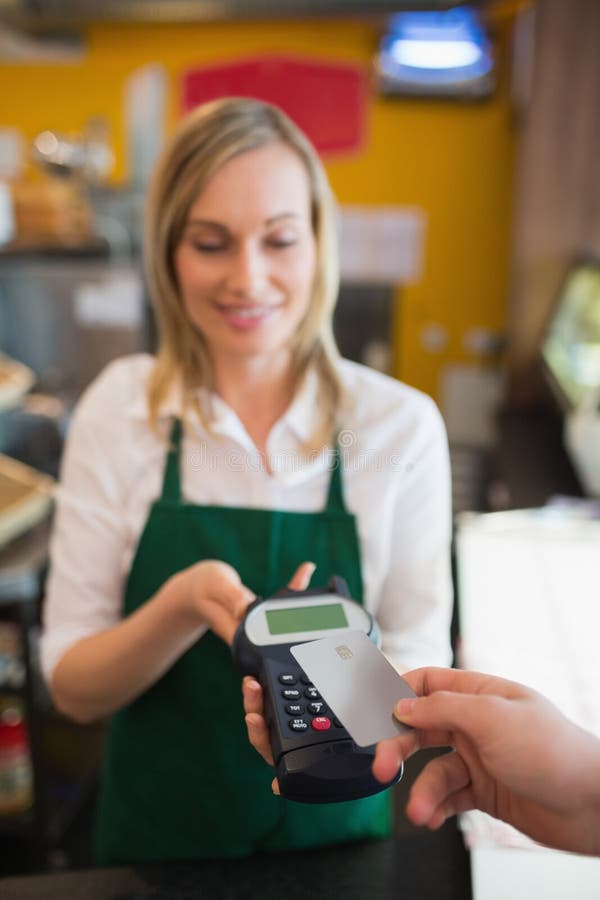 Female Worker Accepting Payment through Credit Card Stock Photo - Image ...