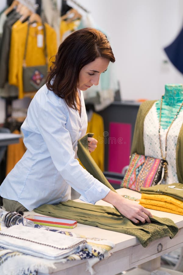 Female Worker in Clothing Store Stock Photo - Image of girl, woman ...