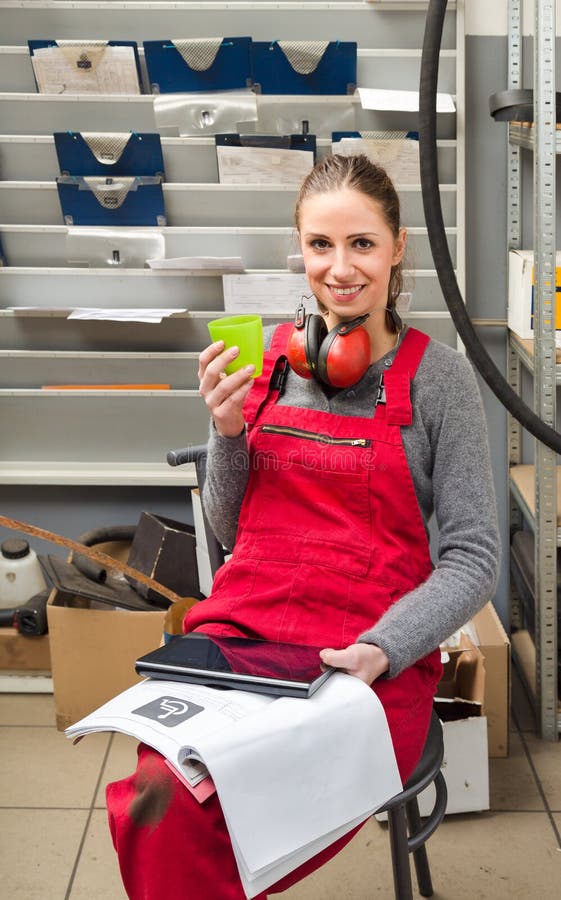 Female Worker while Coffee Break Stock Image - Image of coveralls ...