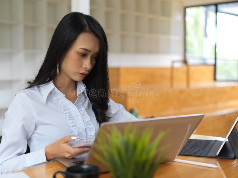 Female Worker Concentrating on Her Work with Laptop in Co Working Space ...