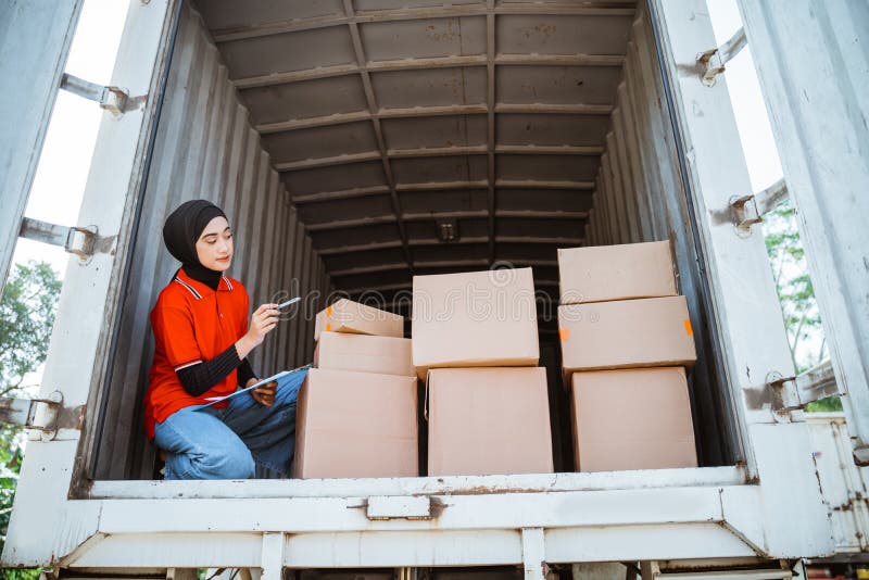 Female Worker Counting Boxes of Packages in a Container Stock Image ...