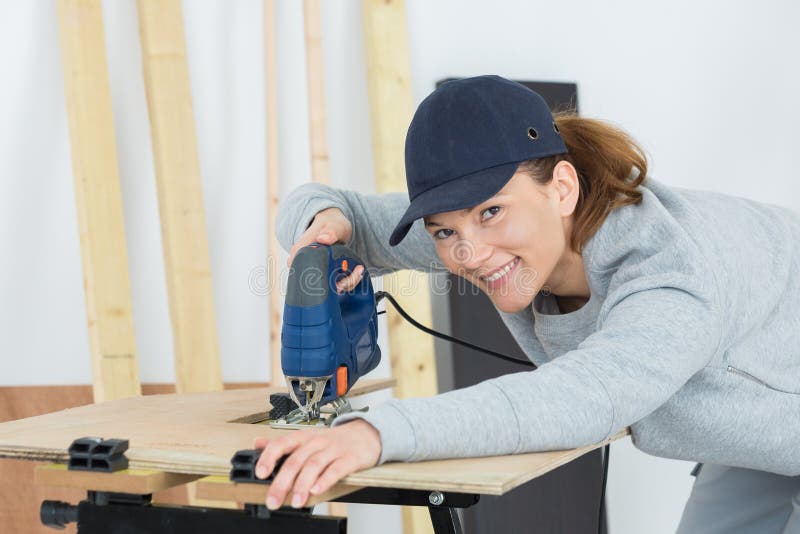 Female Worker Cutting Wood with Angle Grinder Stock Photo - Image of ...